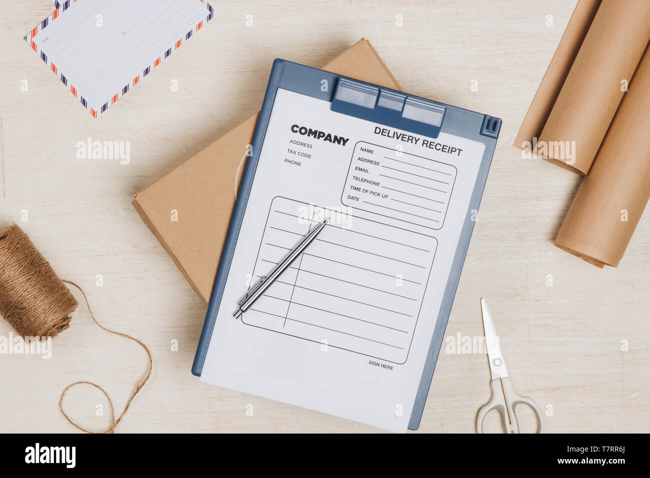 Postal parcels and envelopes and a form for filling with a pen on a ...