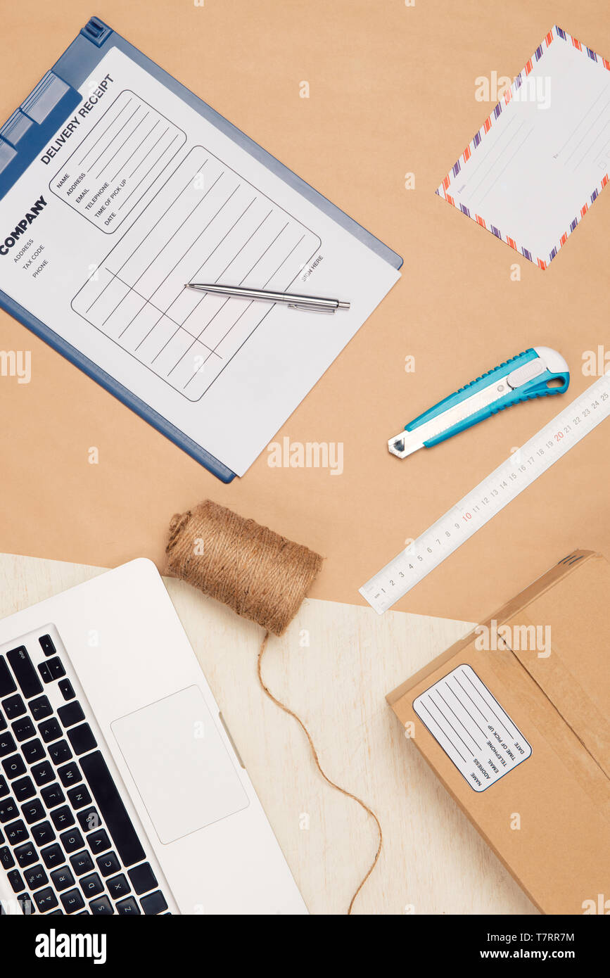 Postal parcels and envelopes and a form for filling with a pen on a ...