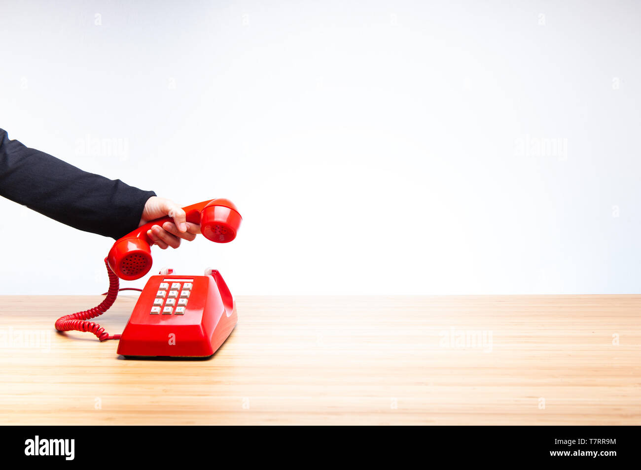 Business woman hanging up old red telephone, classic red telephone ...