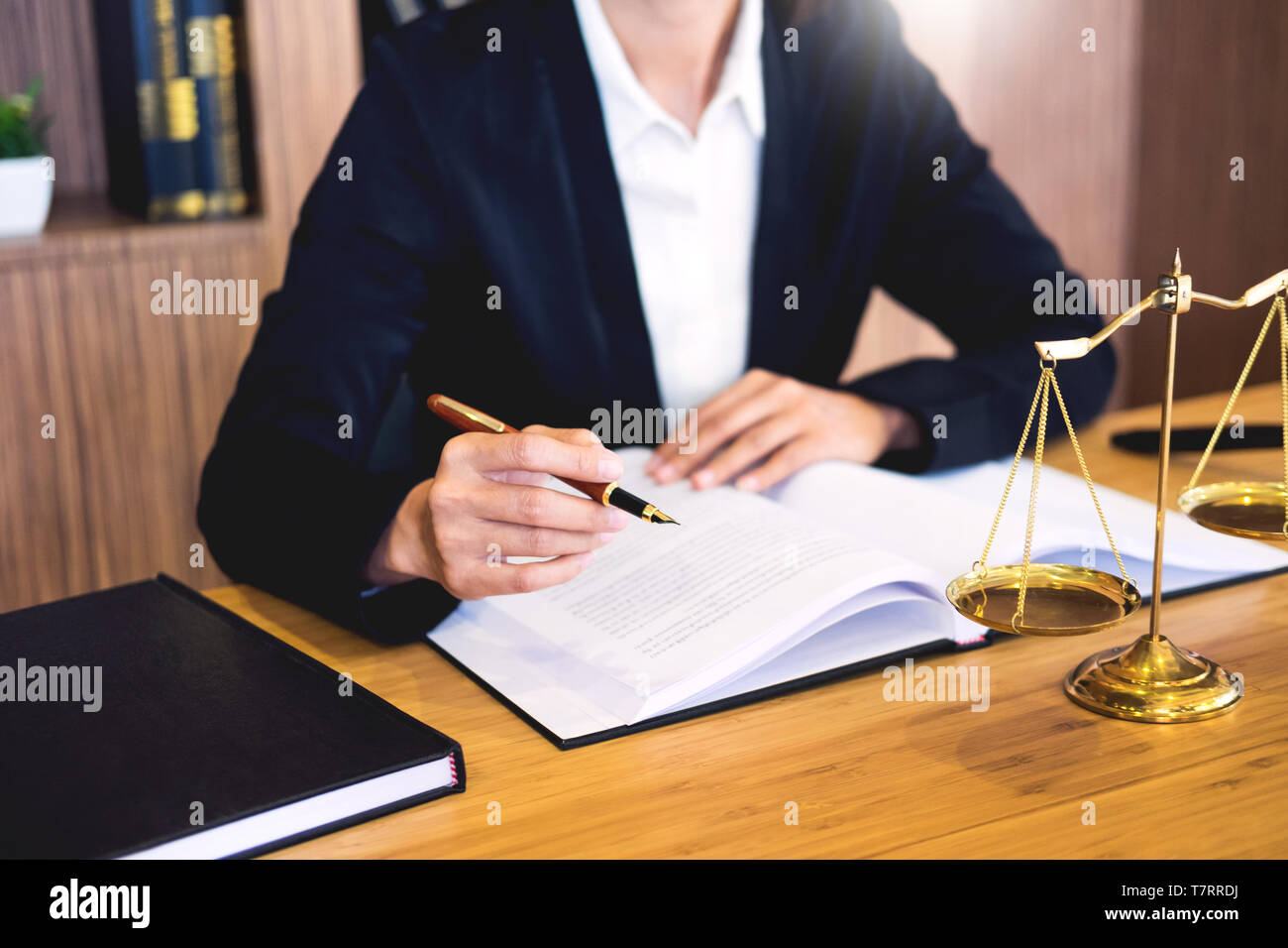 lawyer judge reading documents at desk in courtroom working on wooden ...