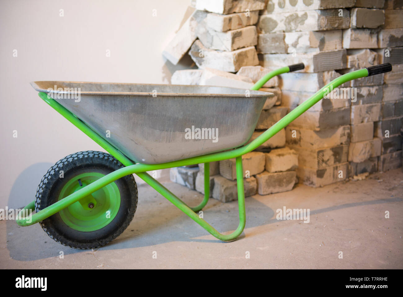 wheelbarrow with bricks for apartment renovation Stock Photo - Alamy