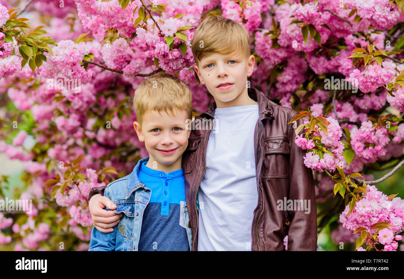 Brotherhood concept. Happy spring holidays. Children enjoy warm spring ...