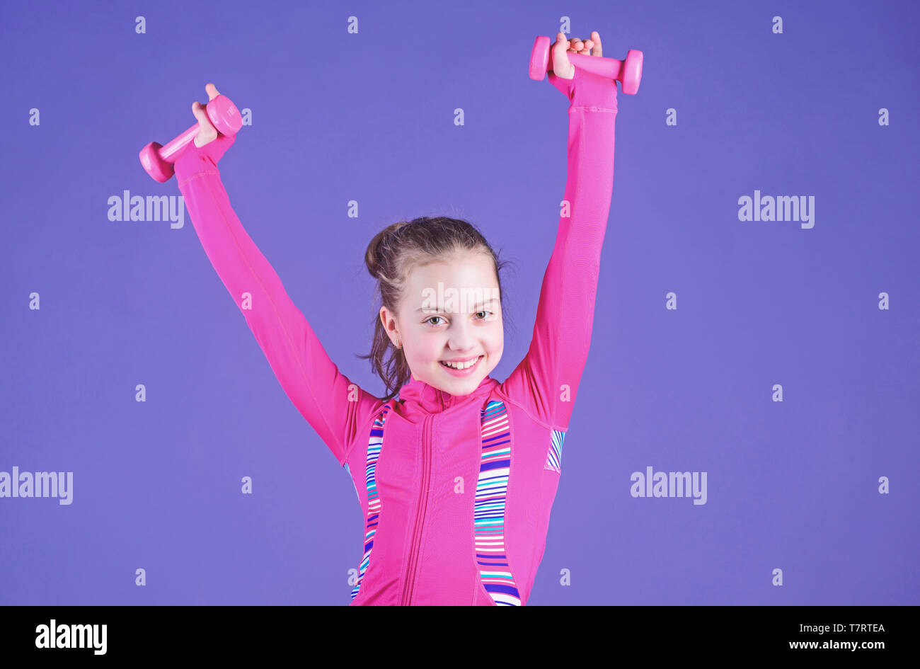 Strong and adorable. Small baby developing strength with dumbells. Fit ...