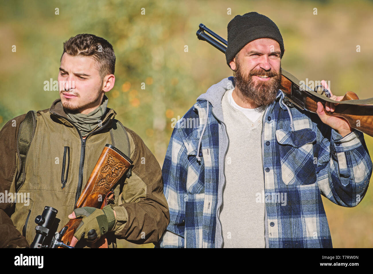 Hunters poachers looking for victim. Hunters with rifles in nature ...