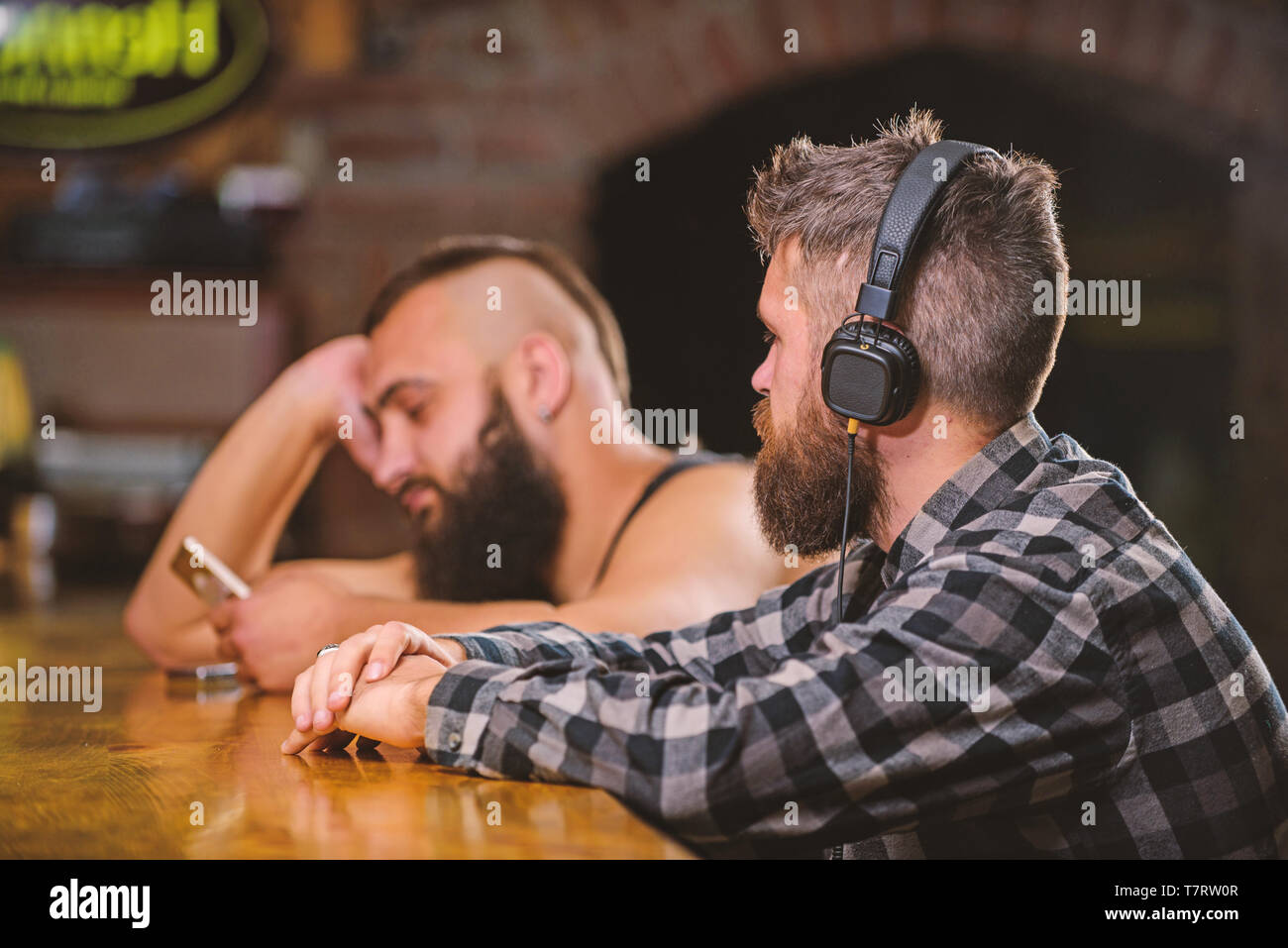 Escape reality. Friday relaxation in bar. Hipster bearded man spend ...