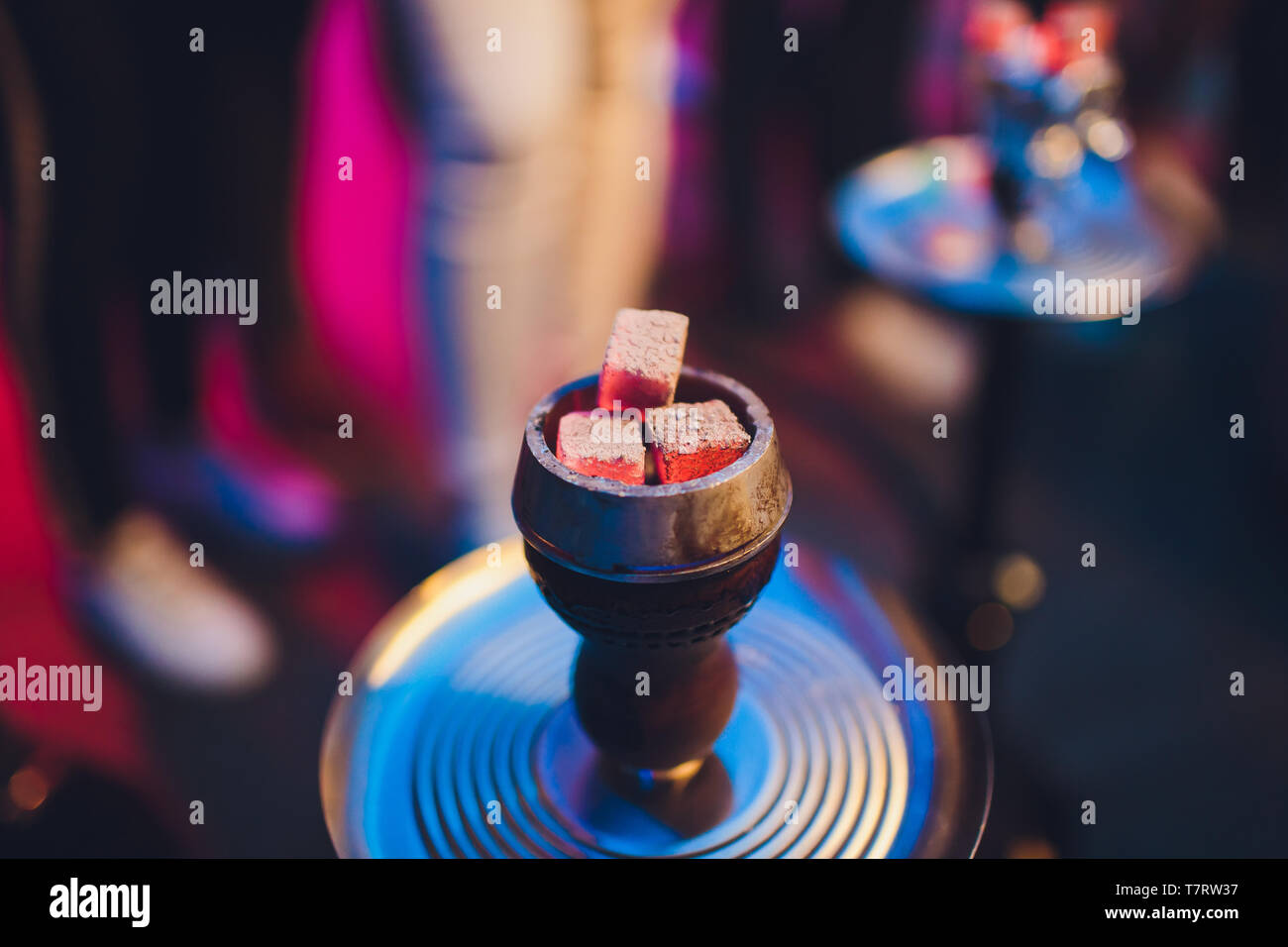 Shisha hookah with red hot coals. Sparks from breathe. Modern hookah ...