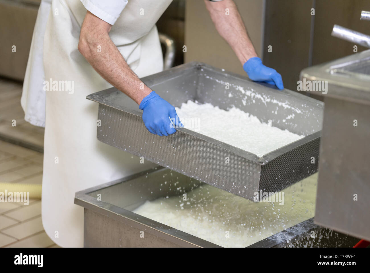 Food industry. Worker checking the conditions of fermentation of the ...