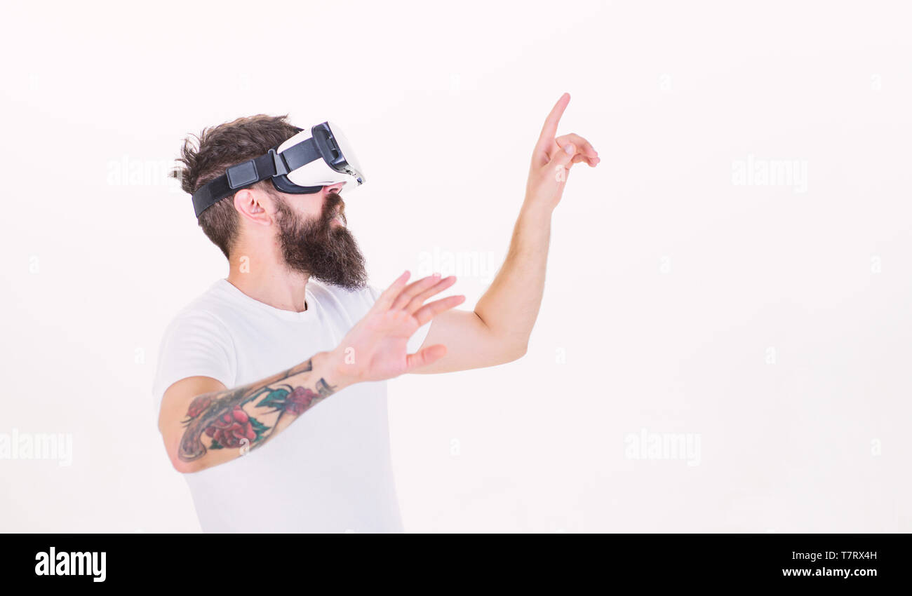 Virtual life. Man bearded hipster VR glasses white background. Interactive surface virtual ...