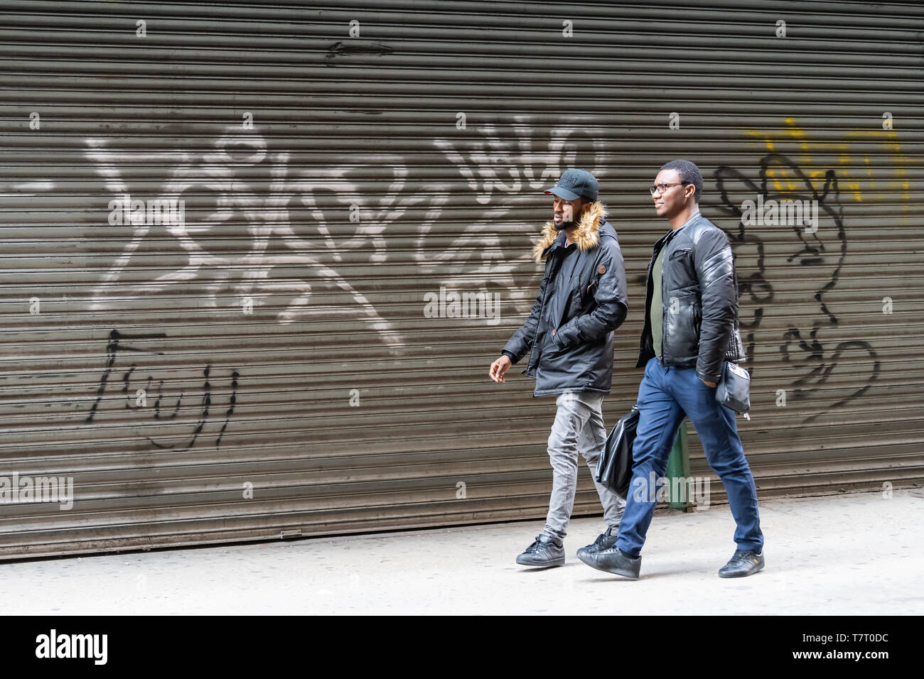 New York City - April 6, 2018: Busy people men walking on sidewalk ...