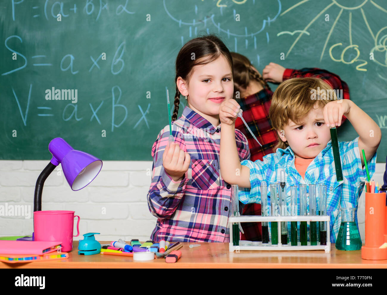 students doing science experiments with microscope in lab. back to ...
