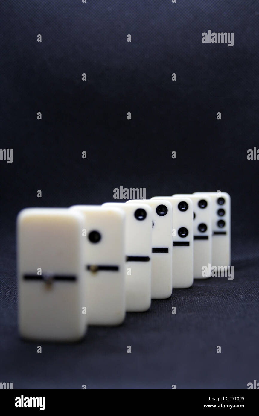 White marble dominoes on a black color background. Dominoes on black ...