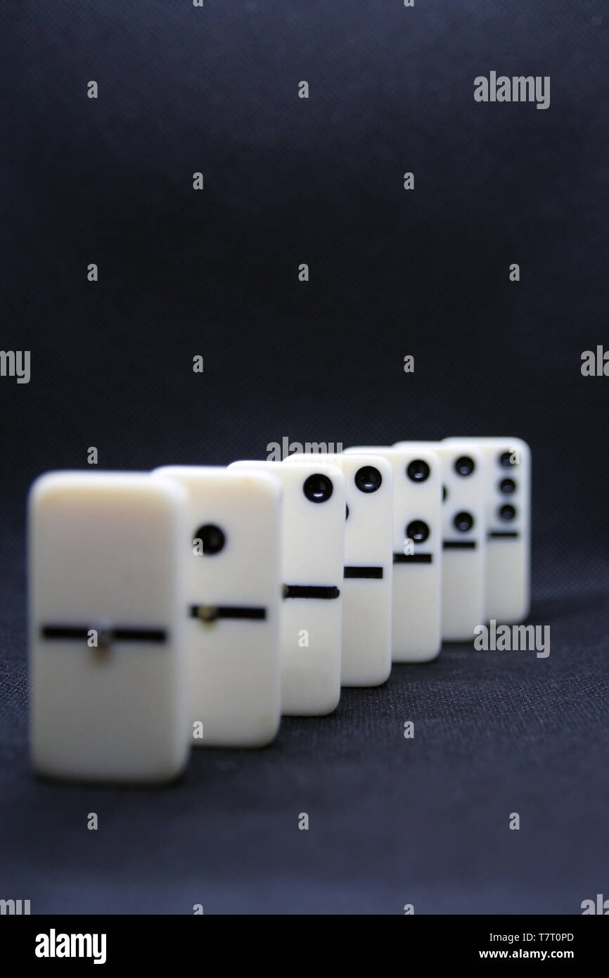 White marble dominoes on a black color background. Dominoes on black ...
