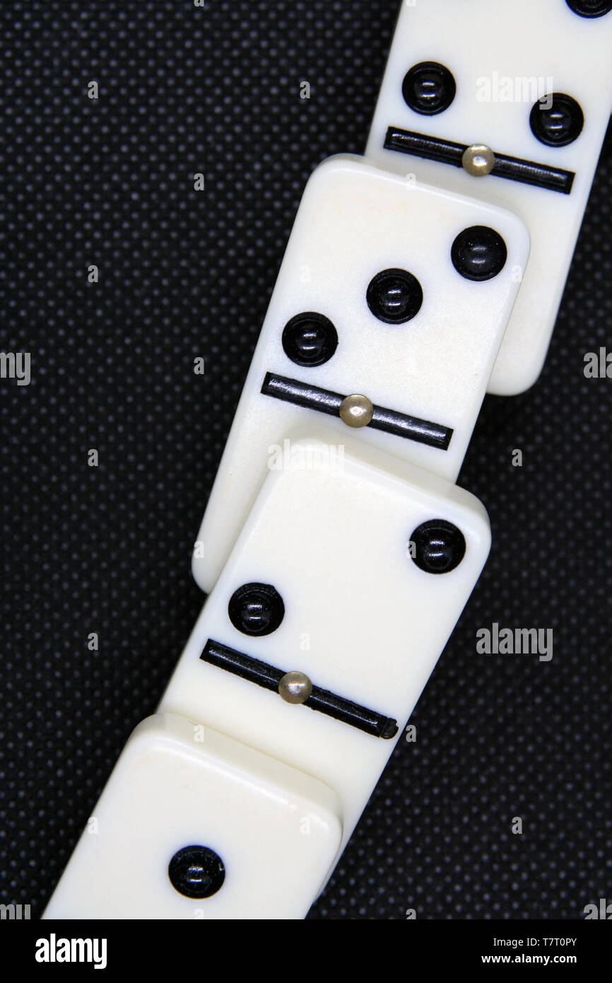 White marble dominoes on a black color background. Dominoes on black ...