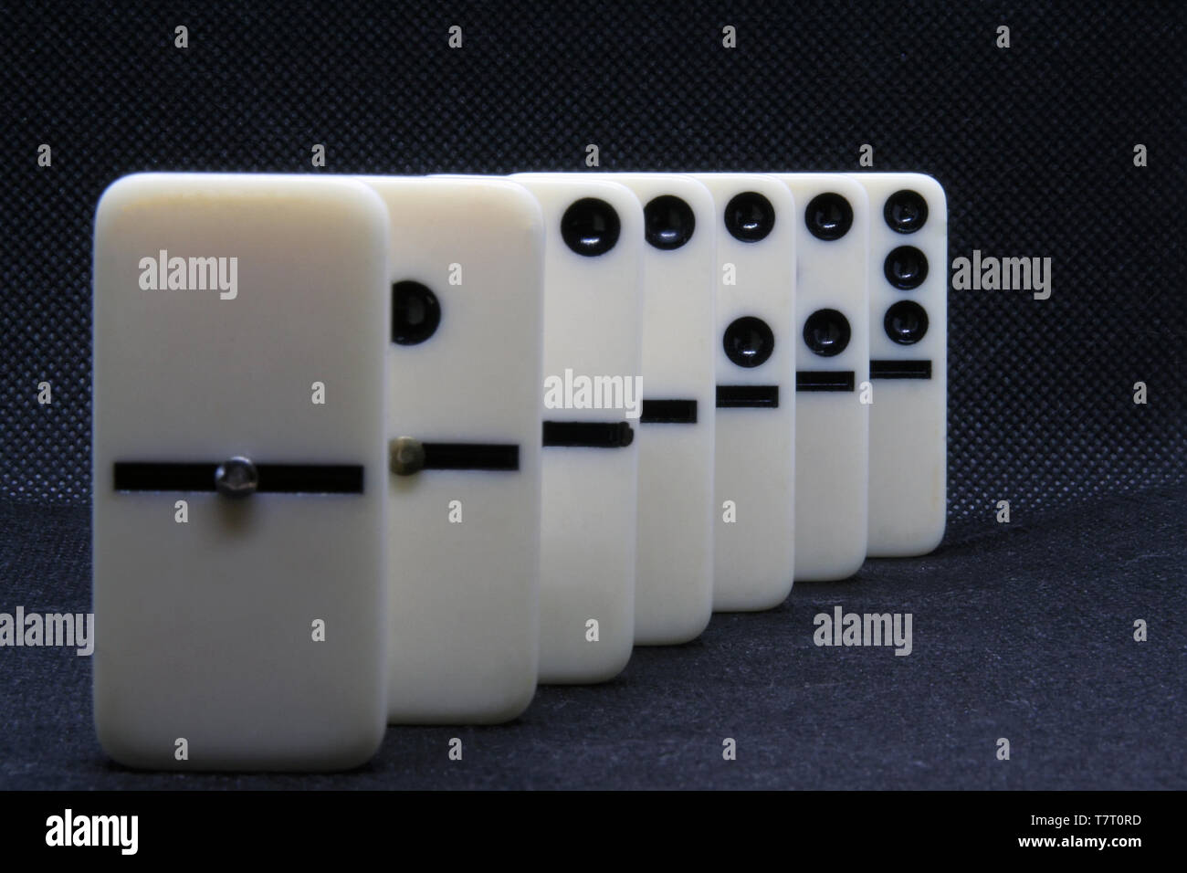 White marble dominoes on a black color background. Dominoes on black ...