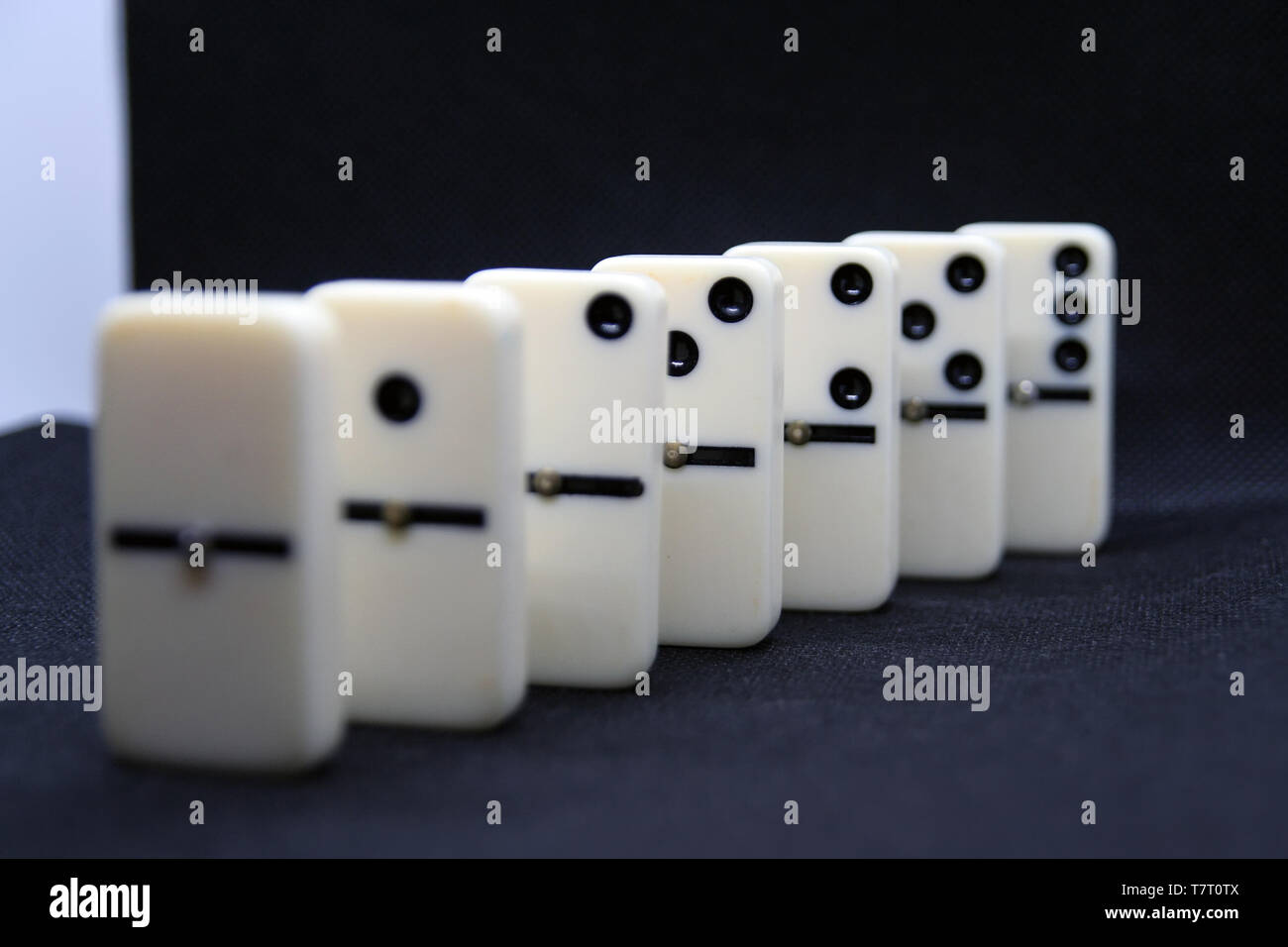 White marble dominoes on a black color background. Dominoes on black ...