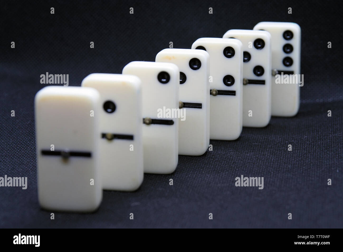 White marble dominoes on a black color background. Dominoes on black ...