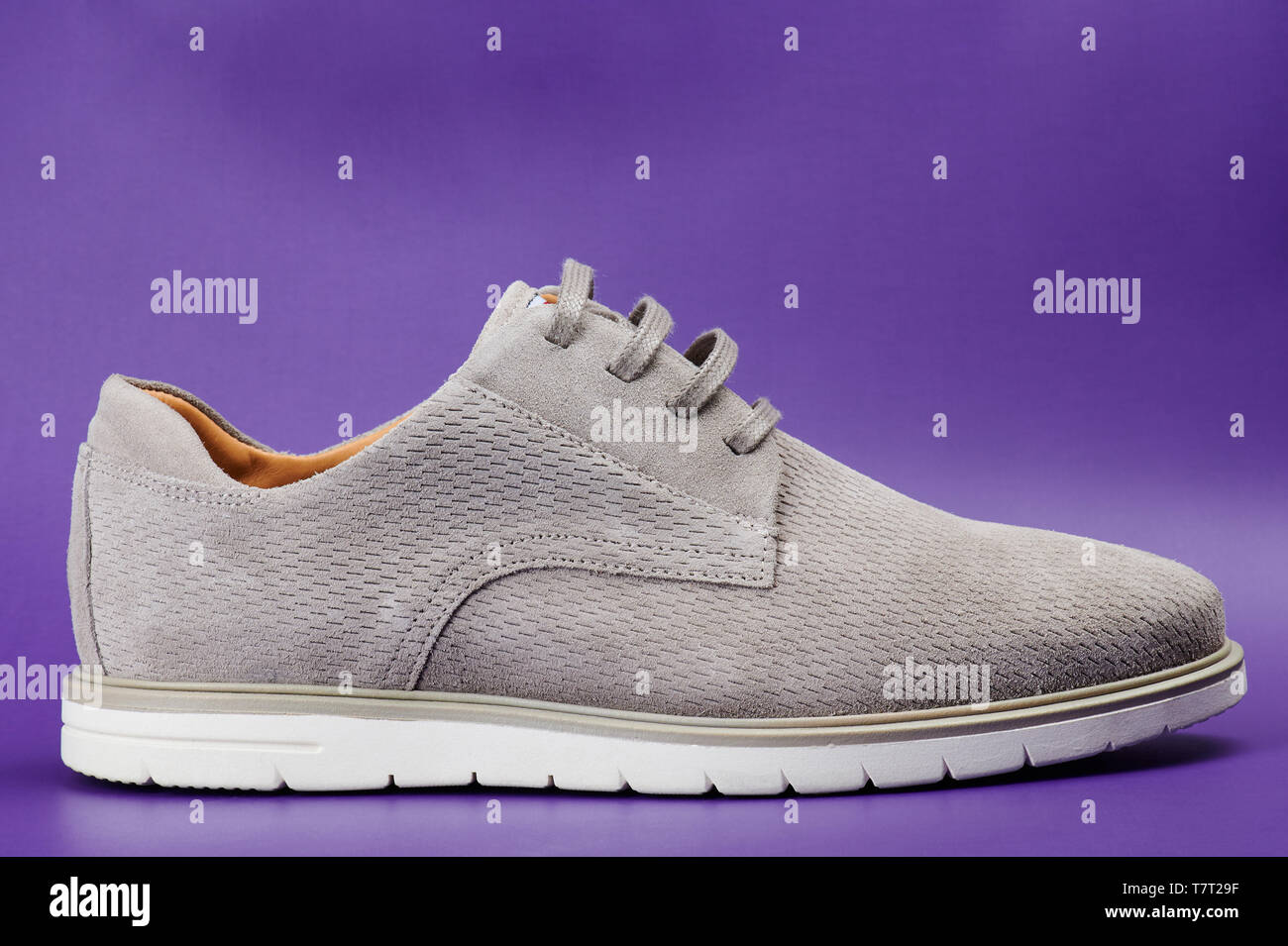 Clean modern gray man shoe isolated on purple background Stock Photo ...