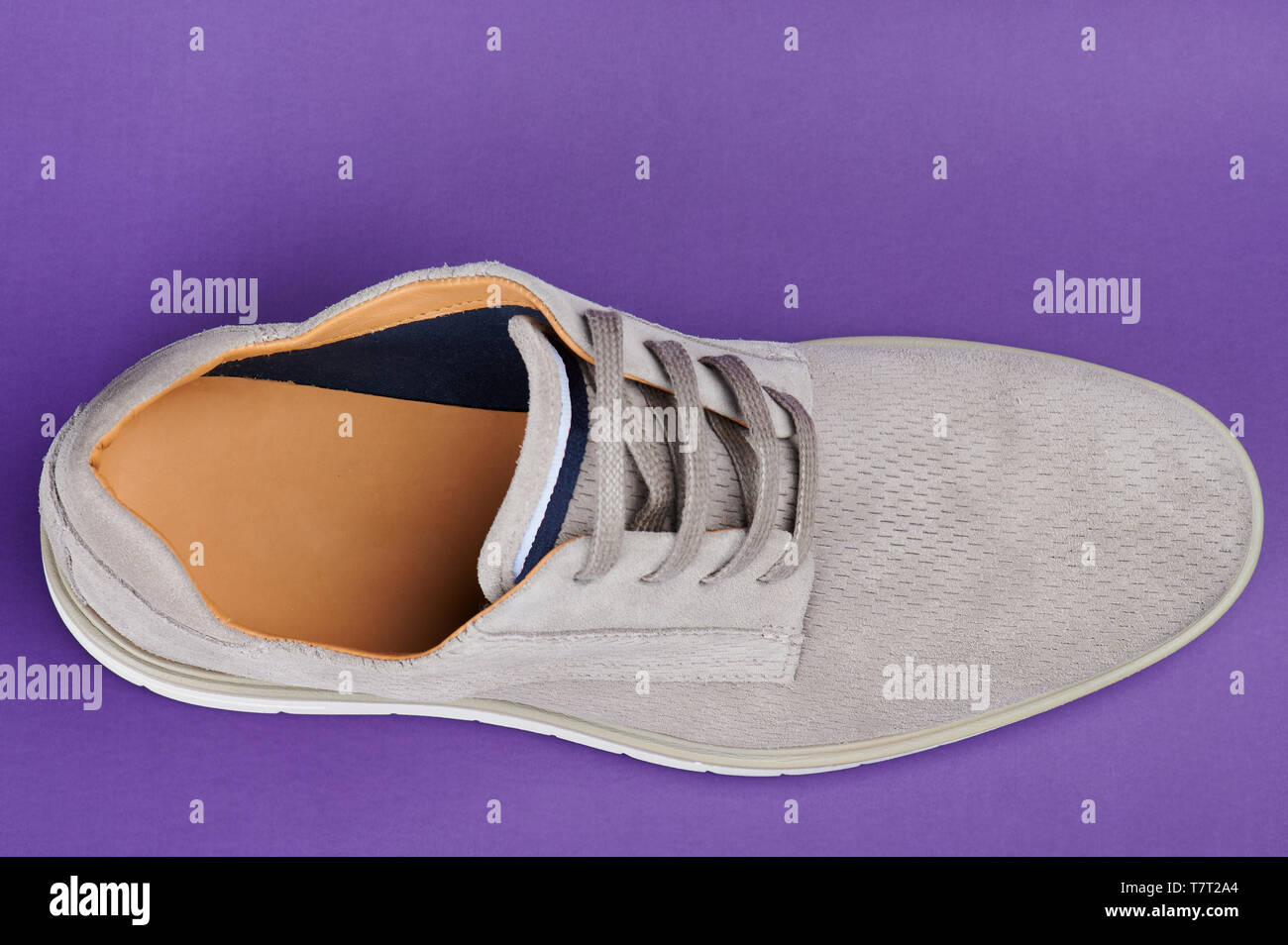 One man gray shoe above top view on purple background Stock Photo - Alamy