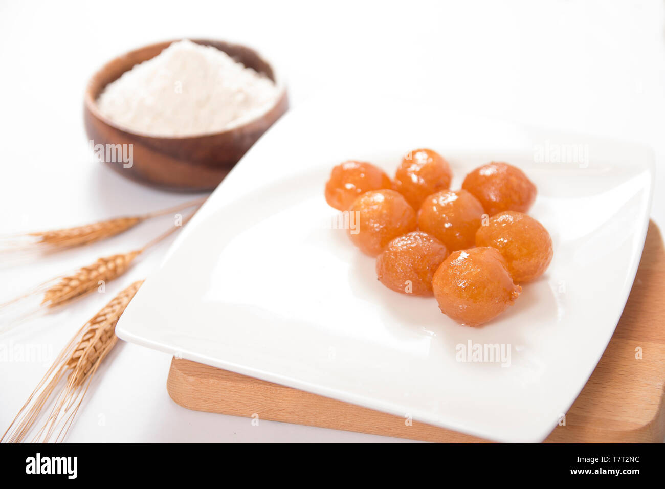 traditional bite dessert with wheat head on a white plate Stock Photo ...