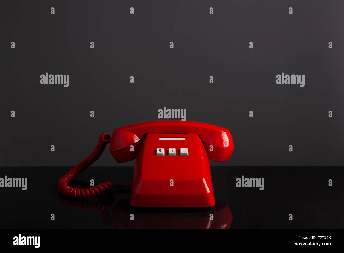 Emergency call 911 on the telephone, red old vintage telephone on black ...