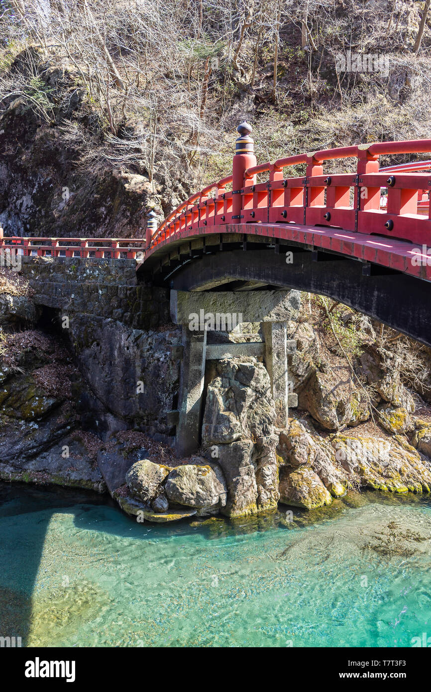 Vertical view on mountains and closeup of famous red Shinkyo bridge ...