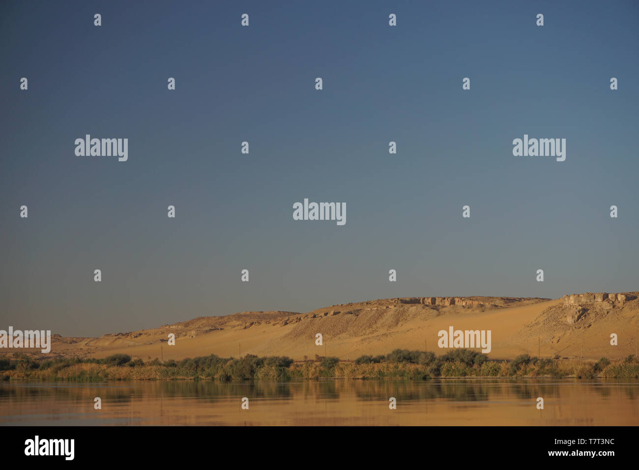Aswan, Egypt: The west bank of the Nile River on a clear, cloudless ...