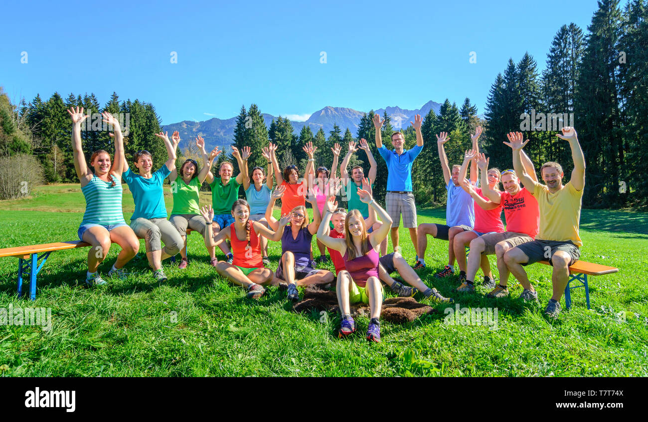 A large group of people celebrating their successful team training ...