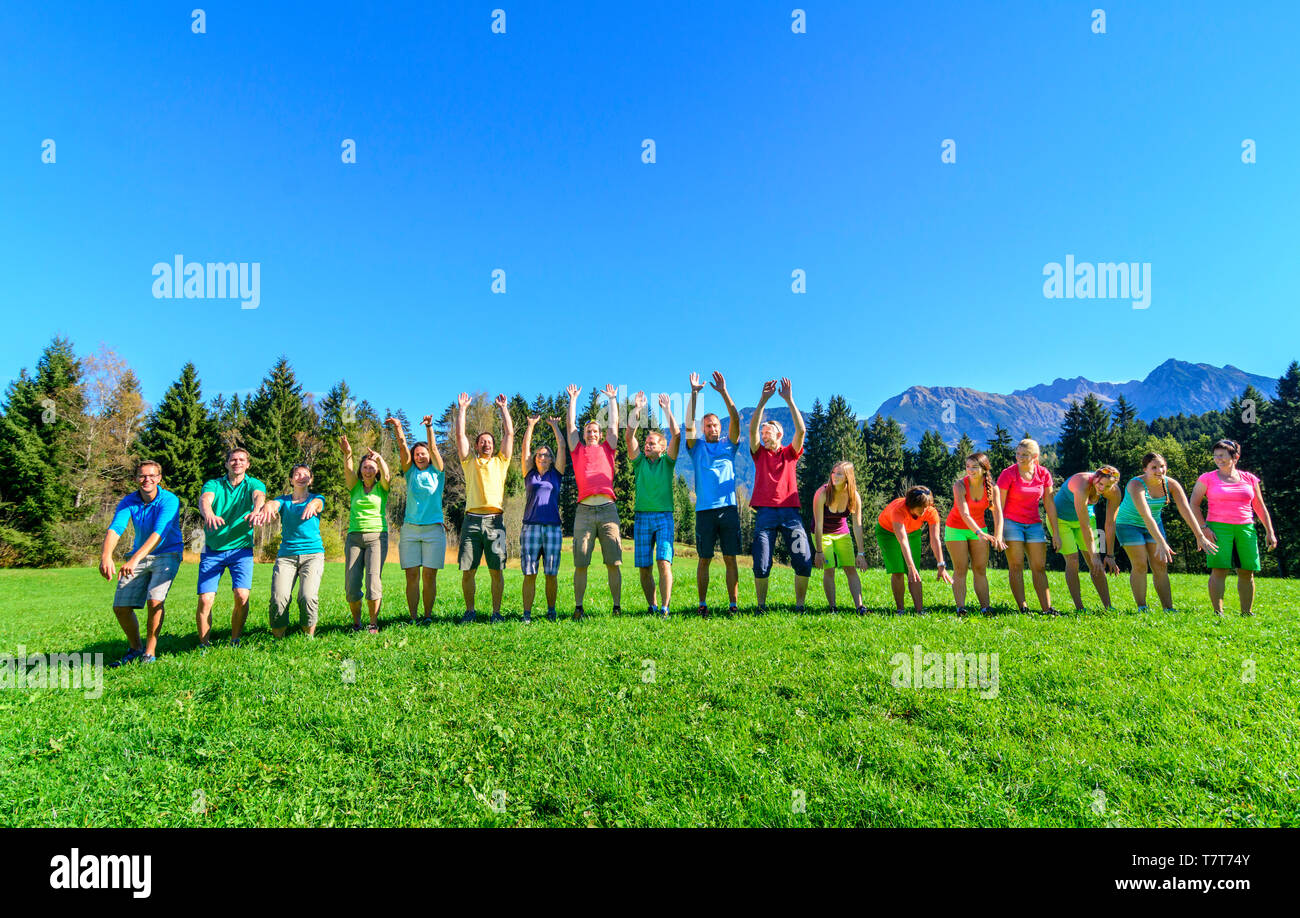 A large group of people celebrating their successful team training ...