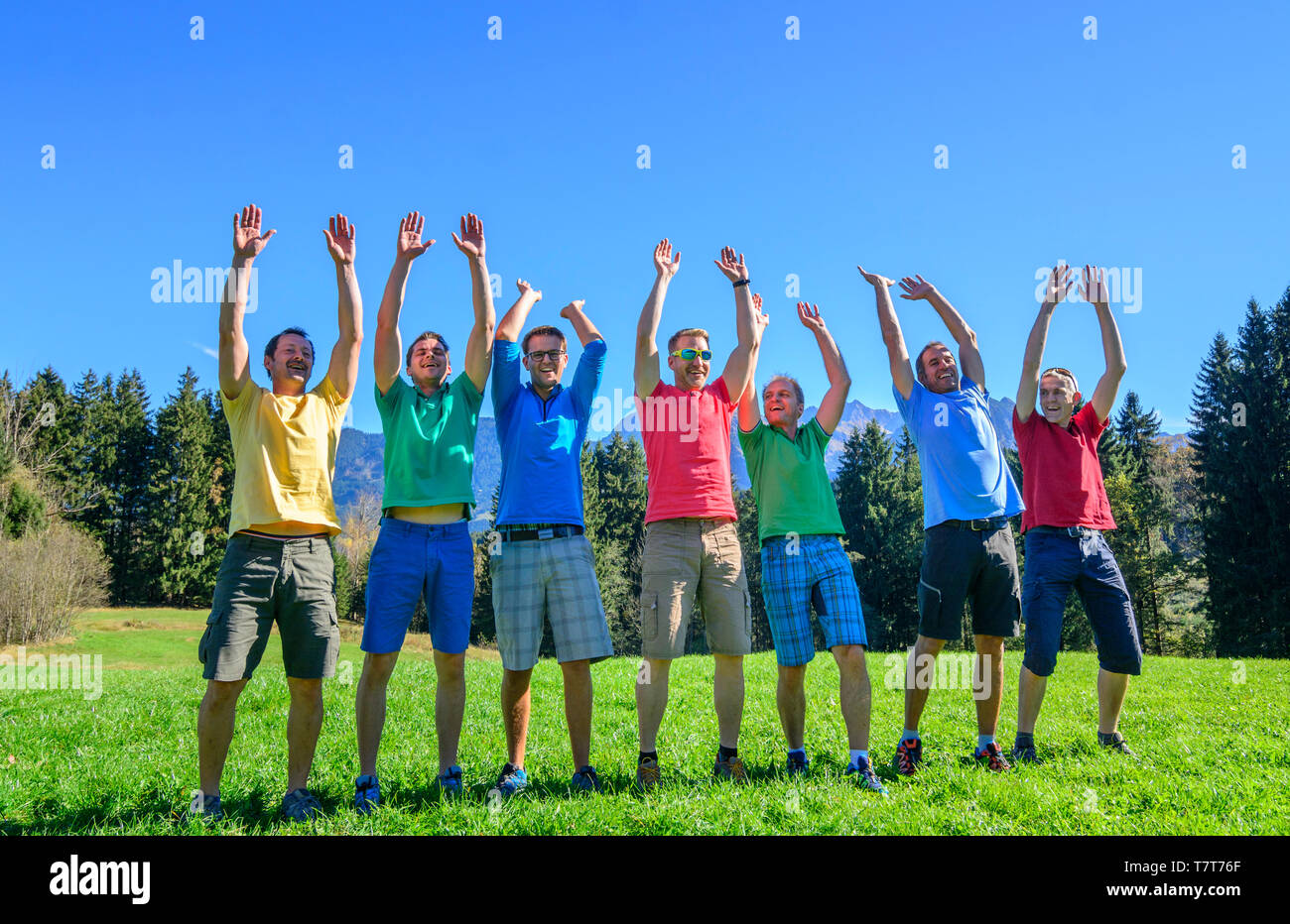 A large group of people celebrating their successful team training ...