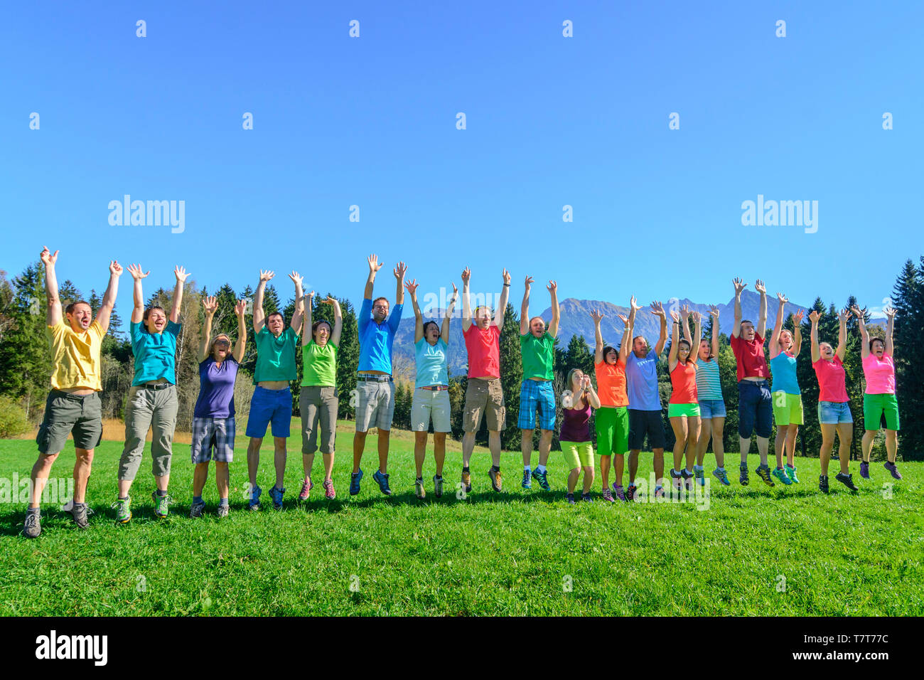 A large group of people celebrating their successful team training ...