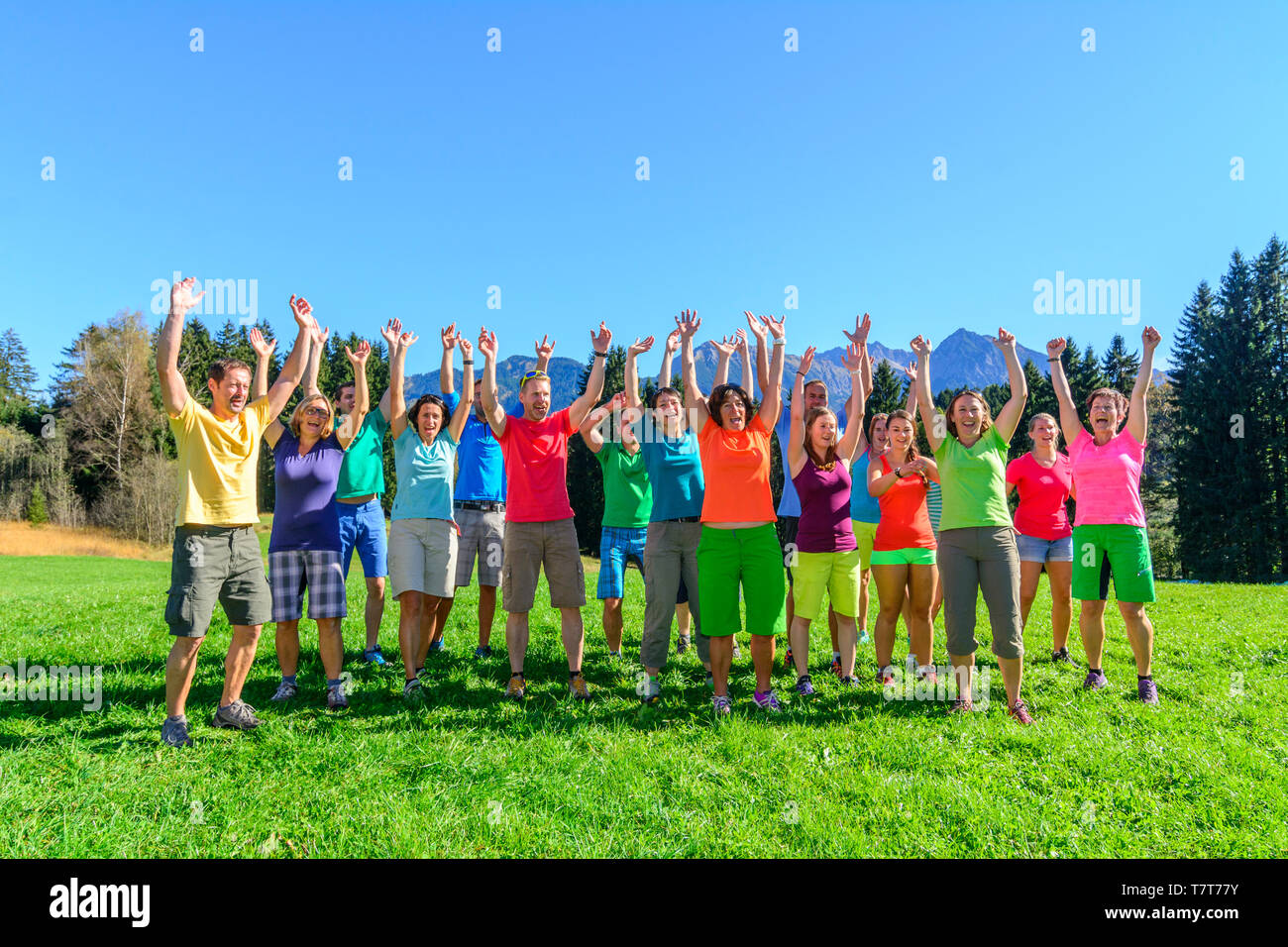 A large group of people celebrating their successful team training ...