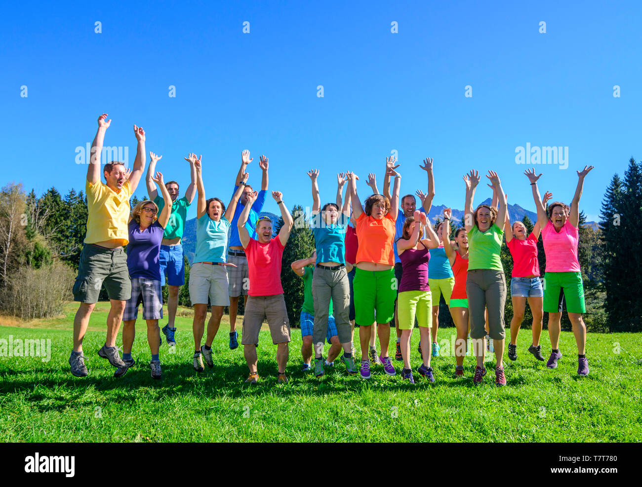 A large group of people celebrating their successful team training ...