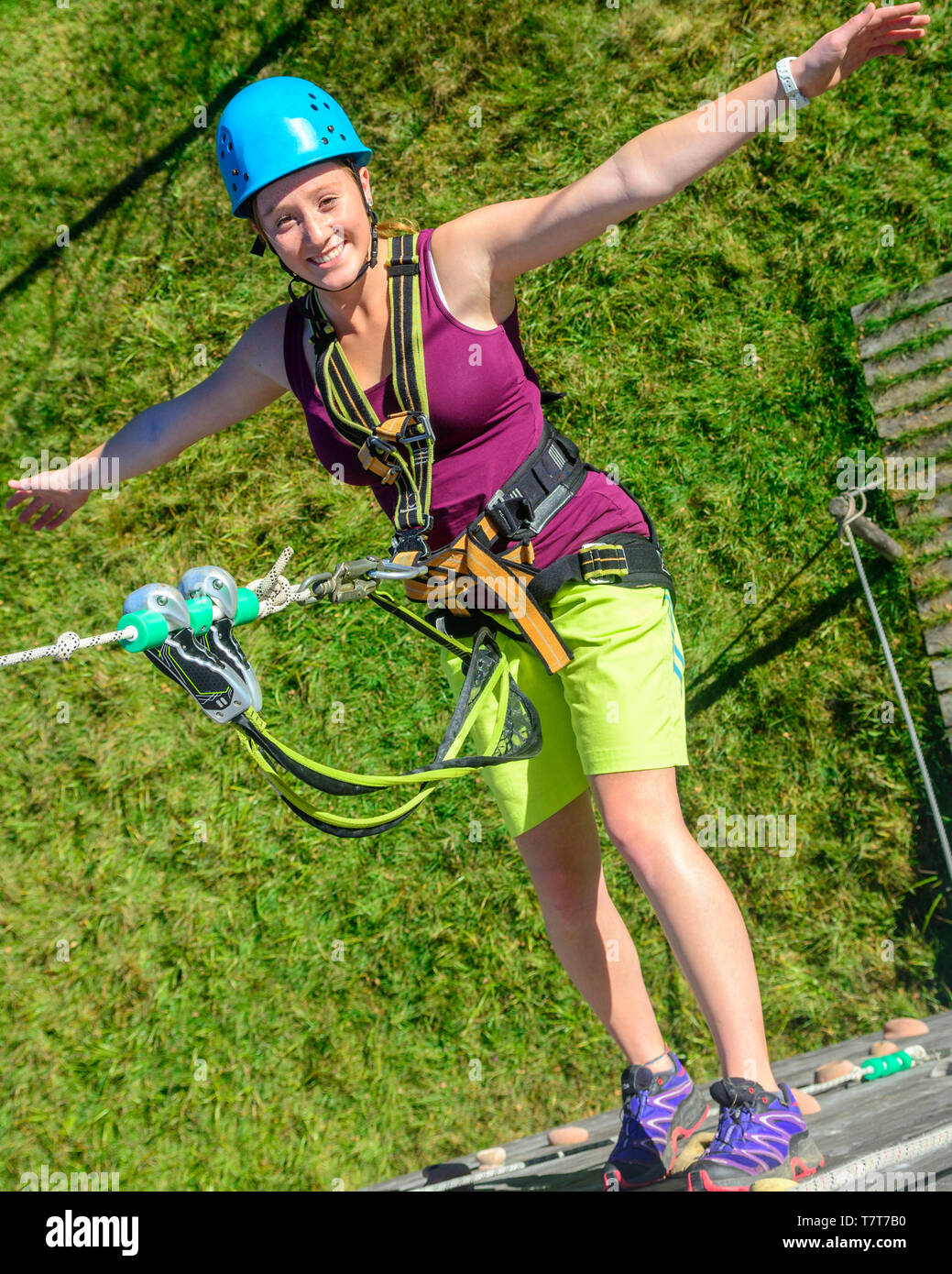 Fearless woman during abseiling training at climbing wall Stock Photo ...