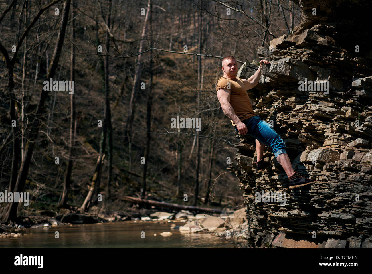 strong sports man climbs the mountain Stock Photo - Alamy