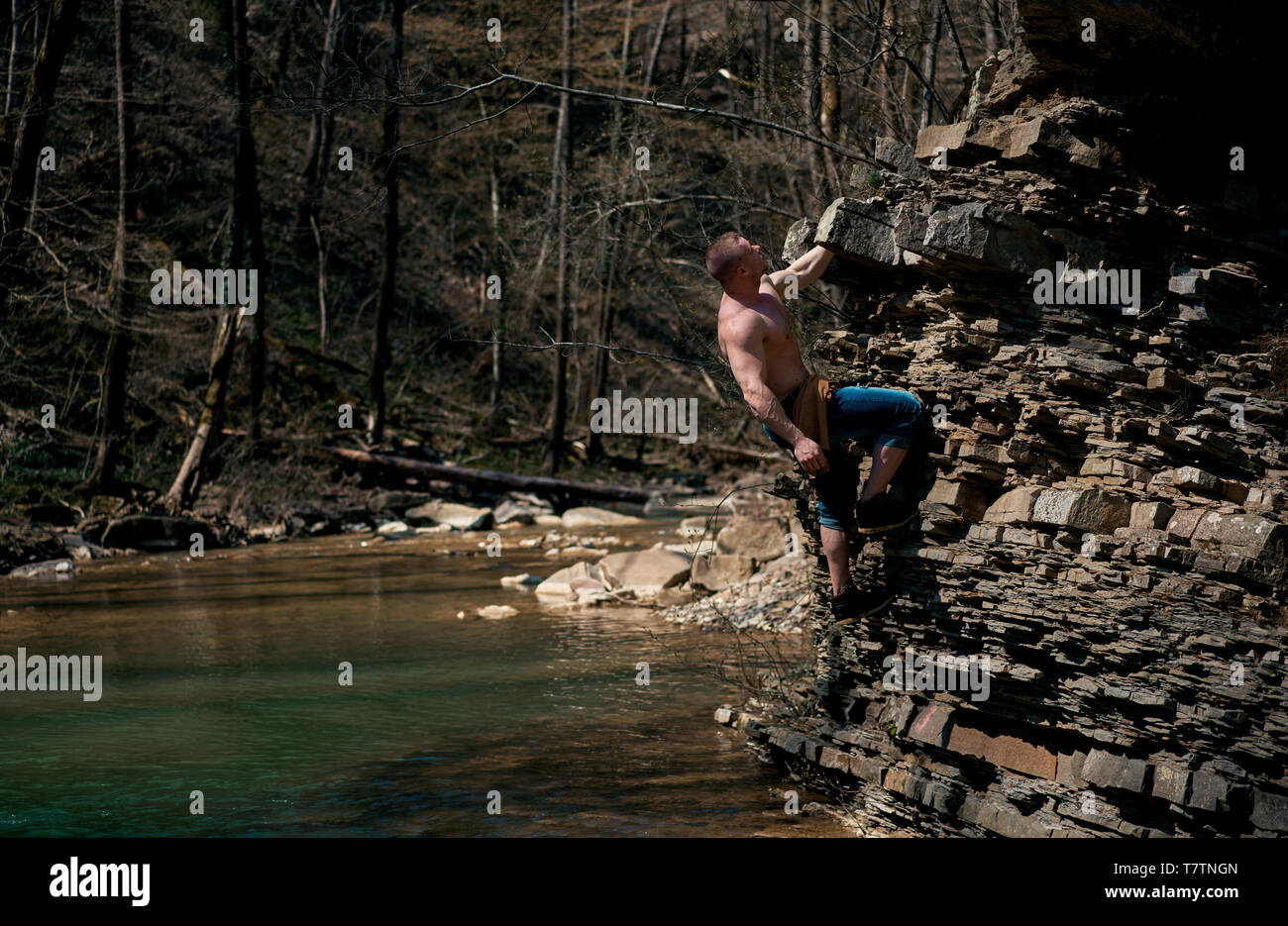 strong sports man climbs the mountain Stock Photo - Alamy