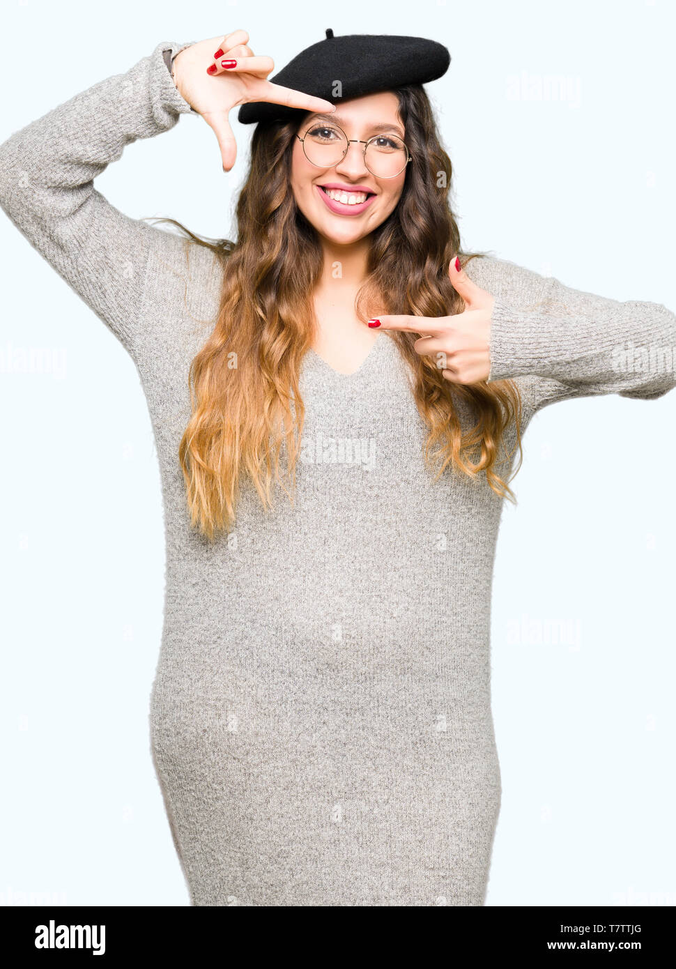 Beautiful young woman wearing glasses and fashion beret smiling making ...