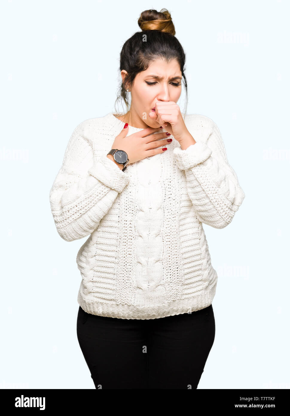 Young beautiful woman wearing winter sweater feeling unwell and ...