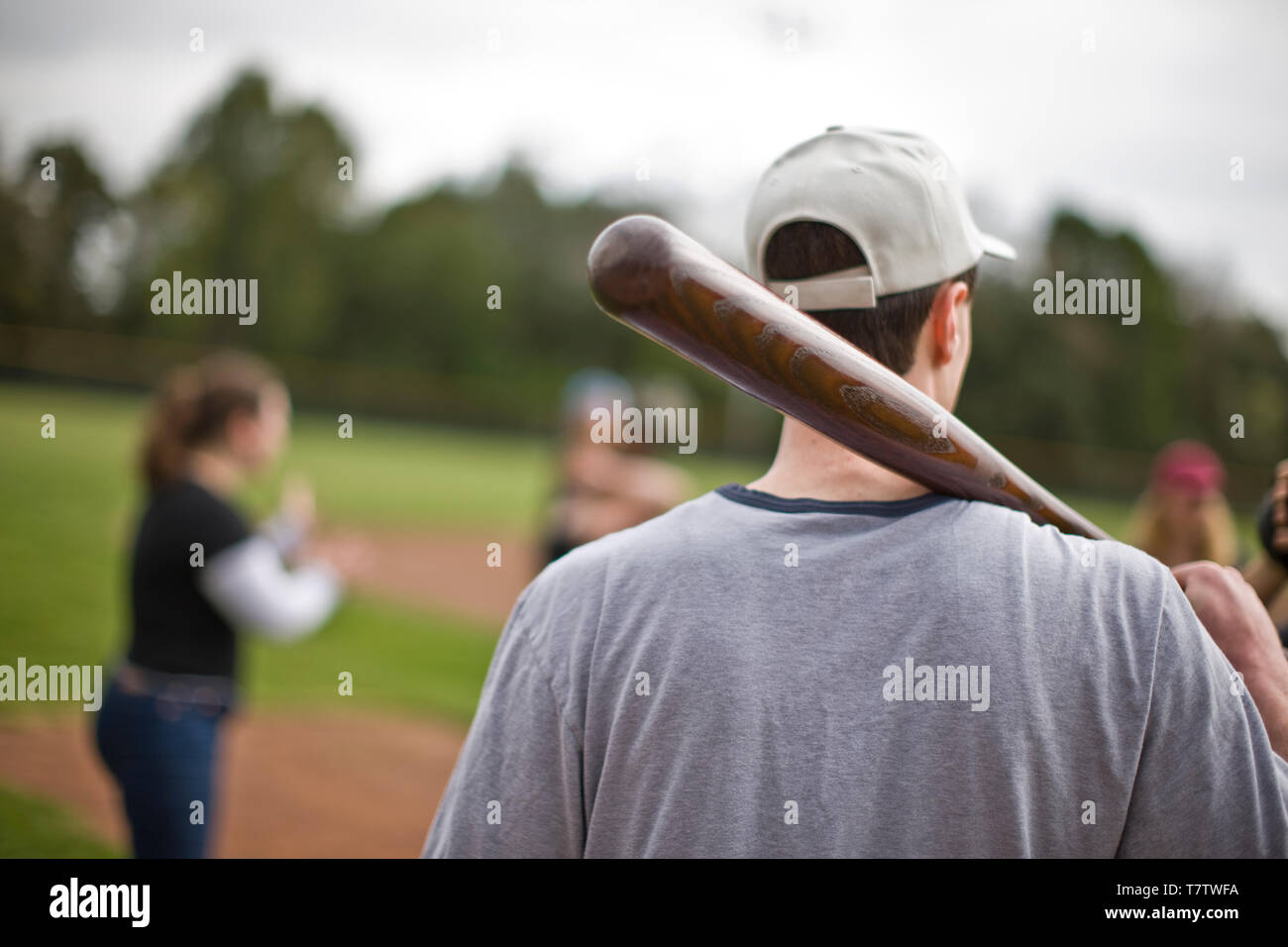 Friends playing baseball Stock Photo - Alamy