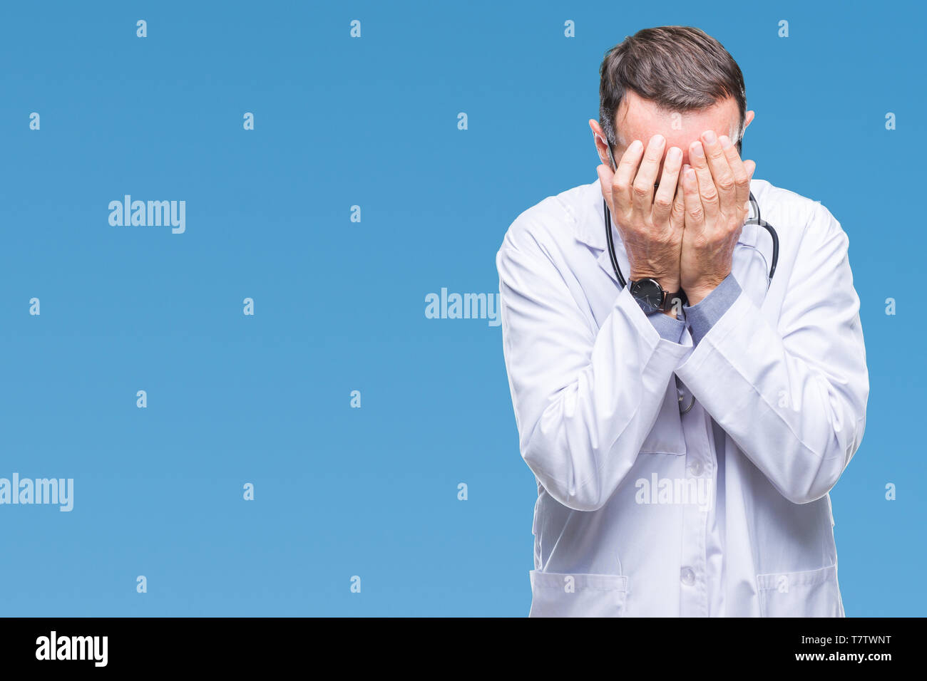 Middle age senior hoary doctor man wearing medical uniform isolated ...