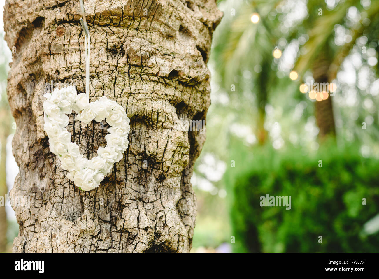 Heart of flowers hanging from a tree as decoration Stock Photo - Alamy