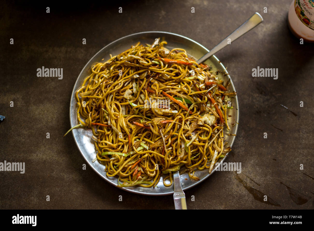 Photo of dry vegetable chow mein noodles served in plate in himalayas ...