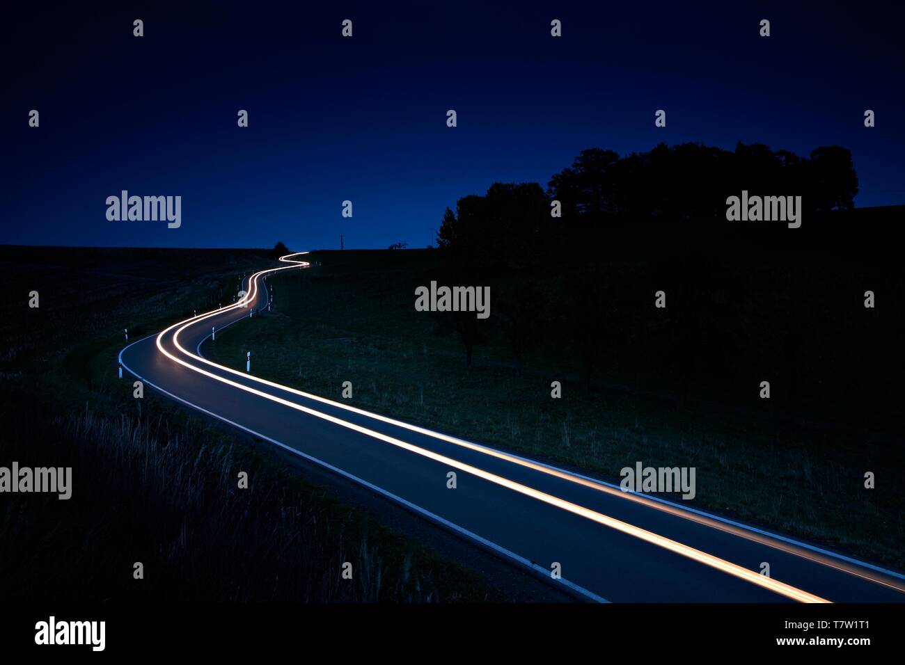 White car driving on winding hi-res stock photography and images - Alamy
