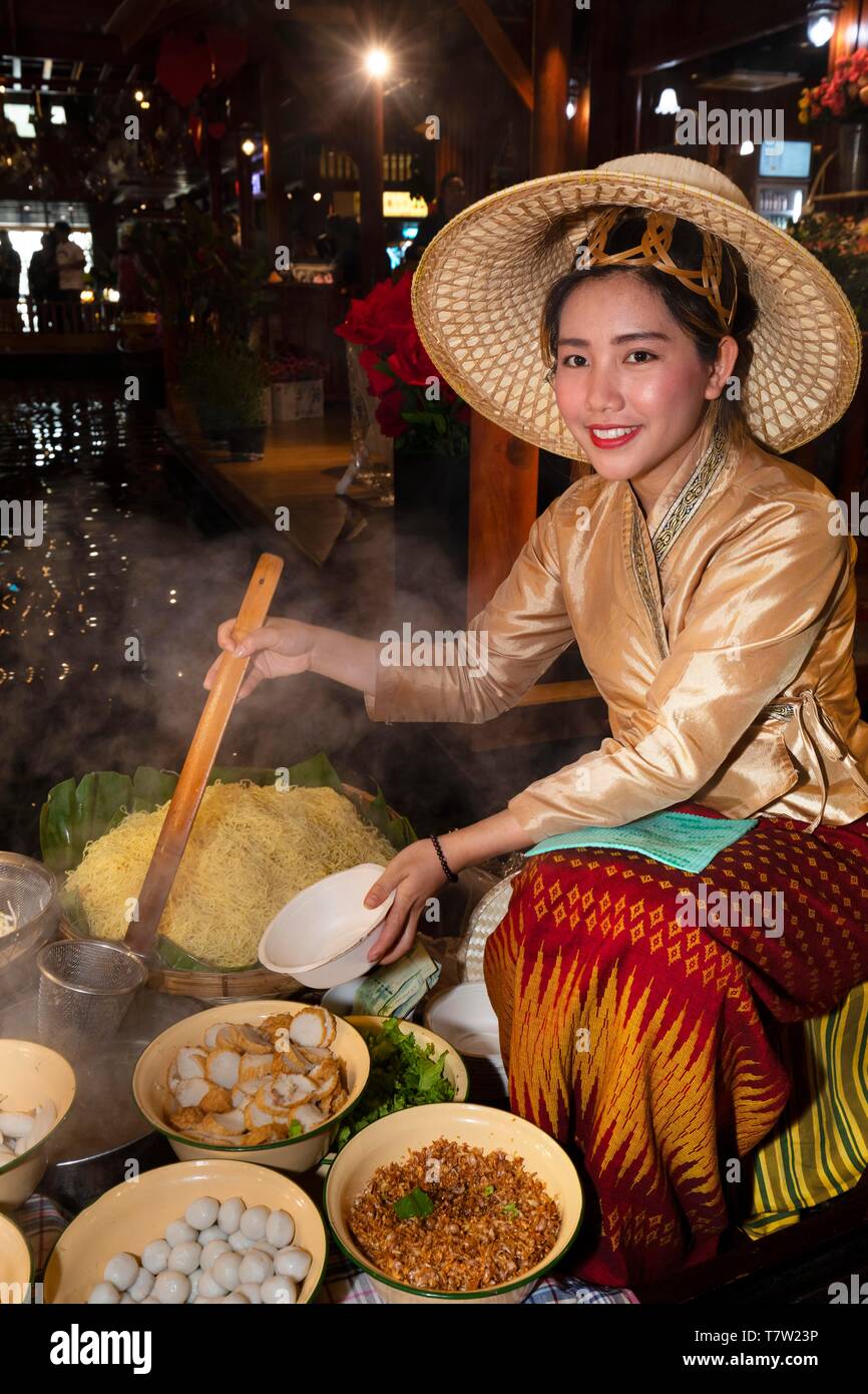 Young woman preparing a noodle soup, Thai noodle soup Kuai Tiao and ...
