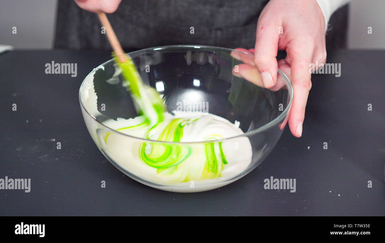 Step by step. Mixing in food coloring into the royal icing to decorate ...