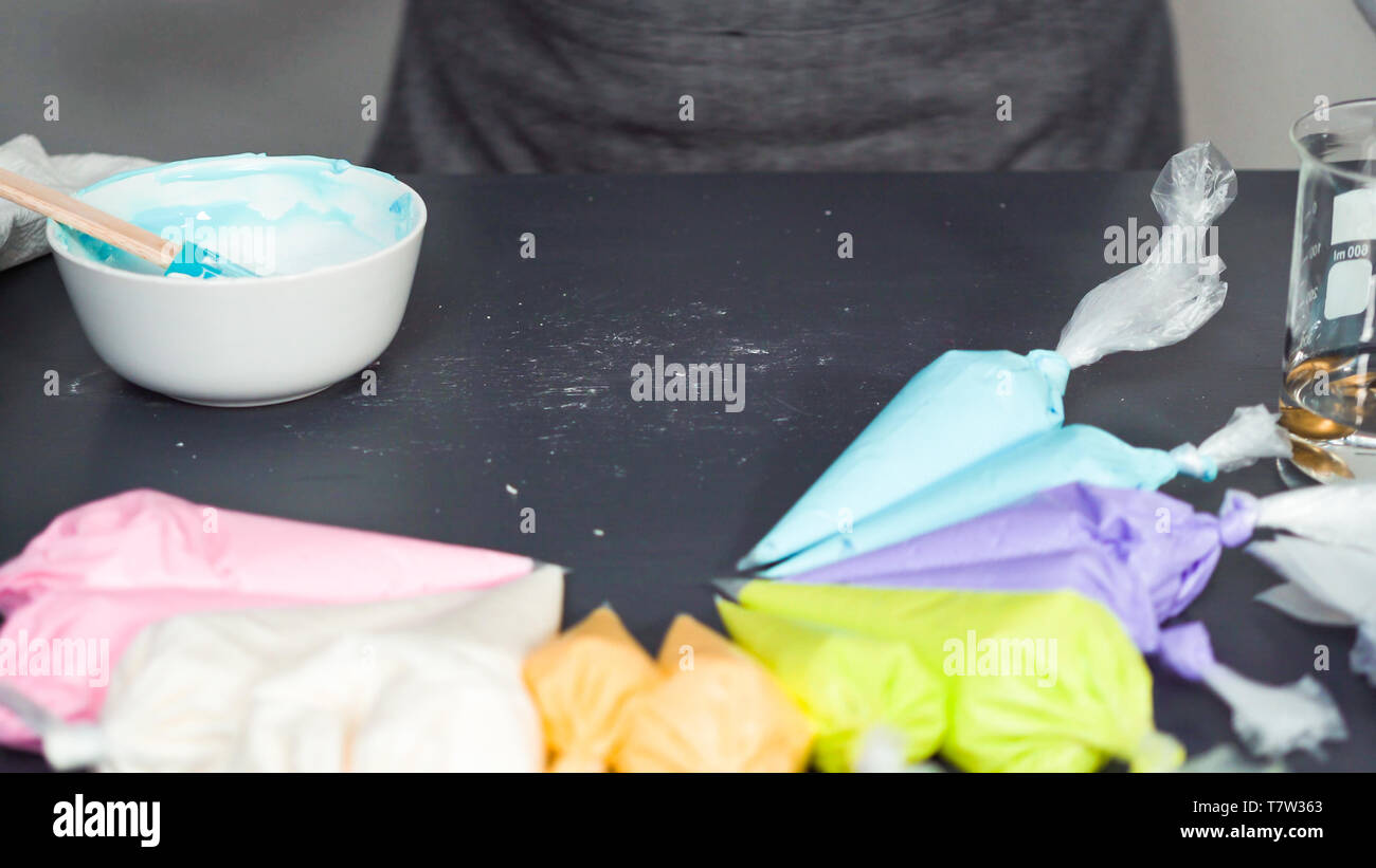 Step by step. Pouring royal icing into the piping bag to decorate sugar ...