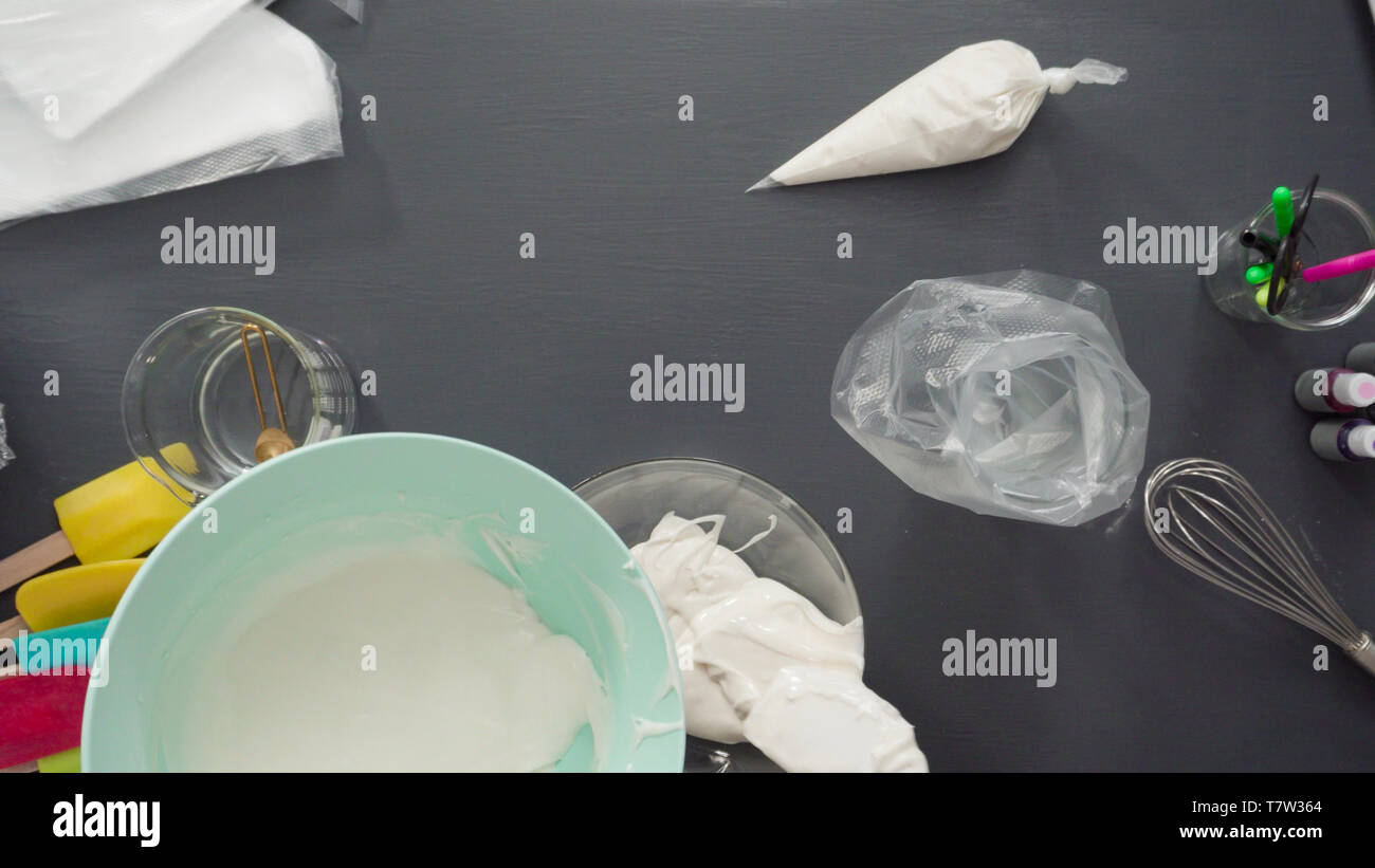 Step by step. Flat lay. Pouring royal icing into the piping bag to ...