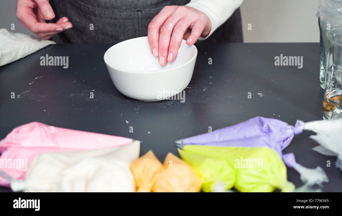 Step by step. Mixing in food coloring into the royal icing to decorate ...