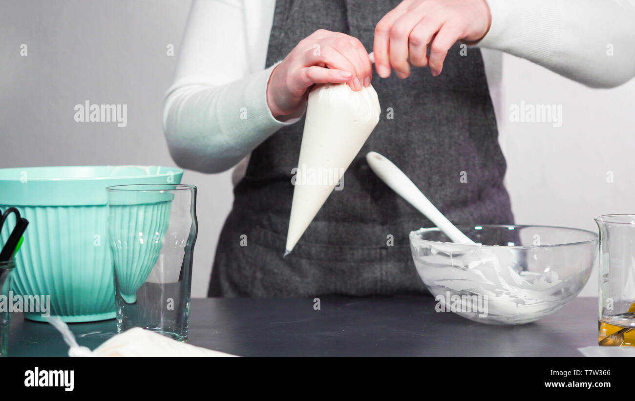 Step by step. Pouring royal icing into the piping bag to decorate sugar ...