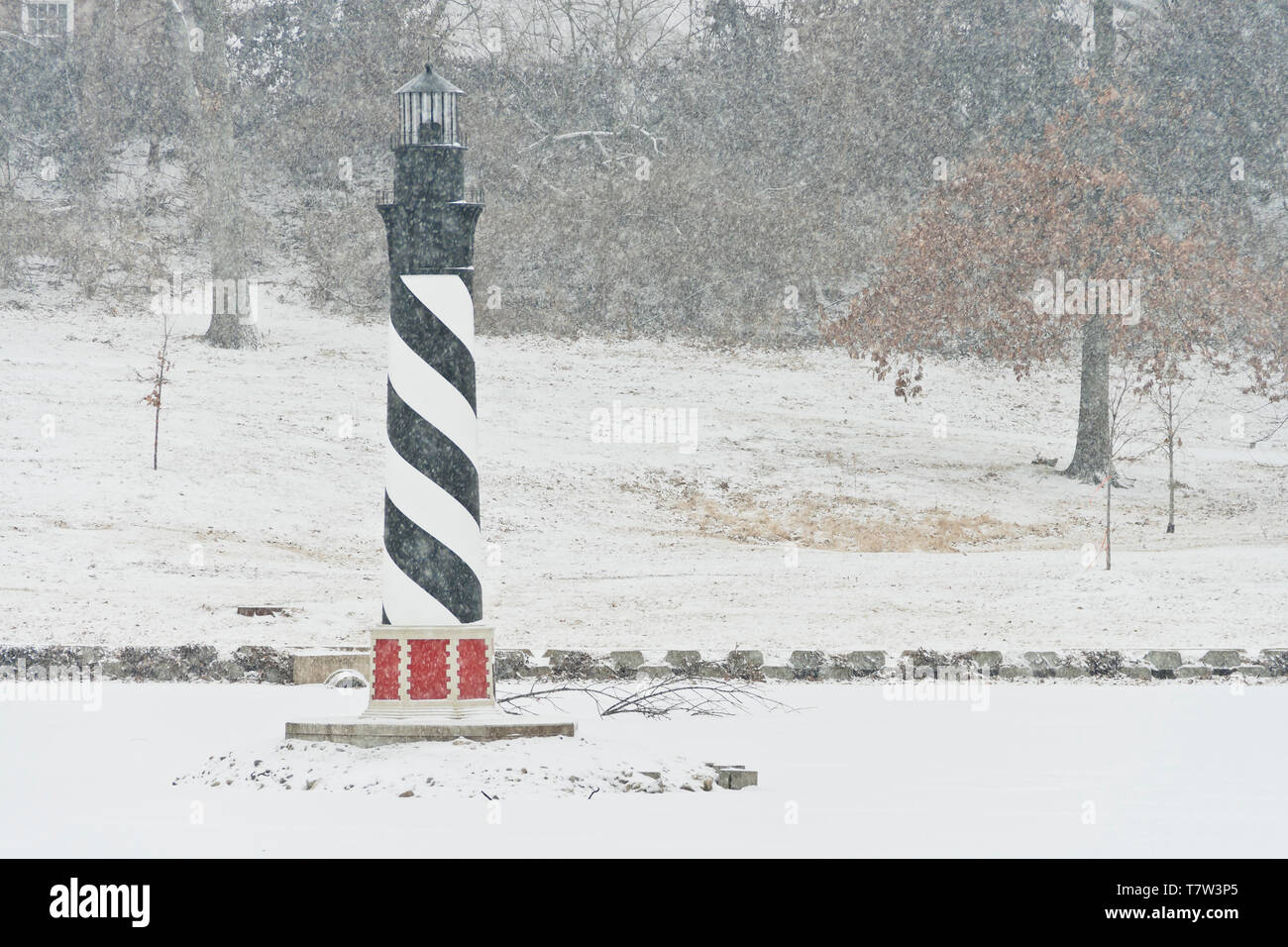 Heavy snowfall on the replica lighthouse in the lake at Ferguson ...