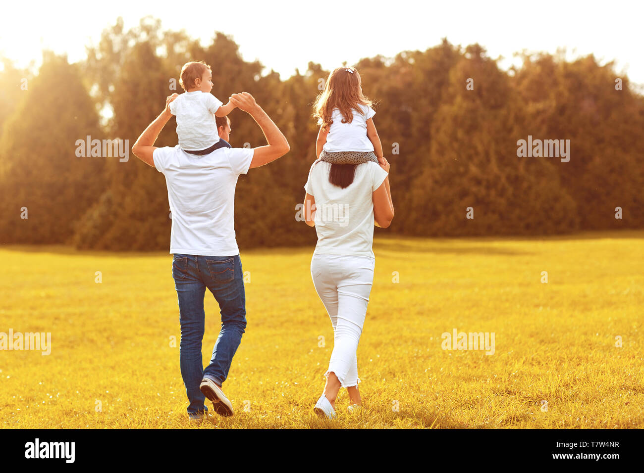 Child parents back view walking hi-res stock photography and images - Alamy
